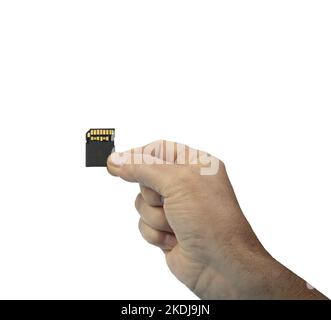 SD memory card on finger isolated on white background. High resolution ...