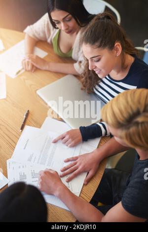 Study session. High angle shot of a group of unrecognizable university ...