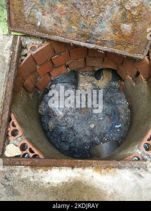 Clogged manhole and building drainage pipes Stock Photo - Alamy