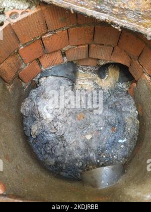 Clogged manhole and building drainage pipes Stock Photo - Alamy