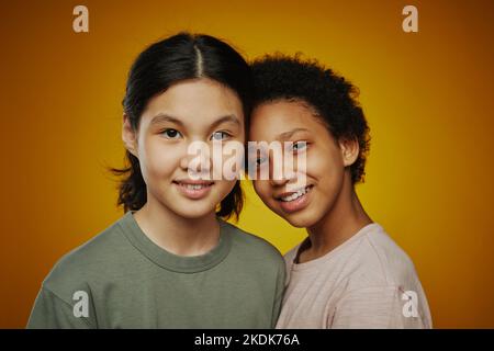 Photo of pretty cute small schoolgirl wear red pullover pulling sledge ...