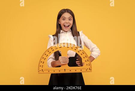 mathematics. surprised teen girl hold protractor ruler. back to school ...