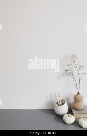 Neutral boho wokspace, still life. Pencils in ceramic holder and blank ...