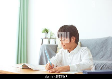 Japanese kid studying at home Stock Photo - Alamy