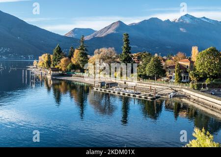 Aerial view of Maccagno with plants that are reflecting in the Lake ...