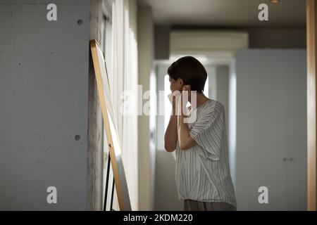 Japanese woman getting ready at home Stock Photo - Alamy