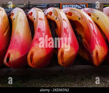 Bright red, orange and yellow kayaks, canoe. Bold abstract image Stock ...