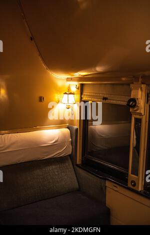 Pullman first class rail travel compartment with old style lamp on ...