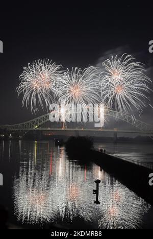 Relections in the Manchester Ship Canal of the exploding fireworks ...