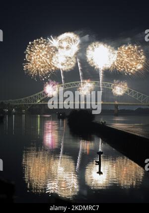 Relections in the Manchester Ship Canal of the exploding fireworks ...