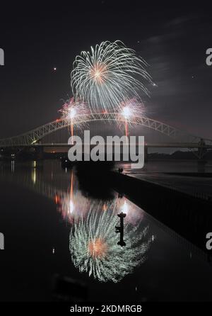 Relections in the Manchester Ship Canal of the exploding fireworks ...