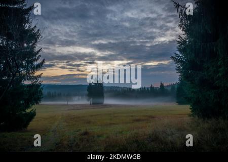 Autumn morning in Jizerske mountains with sun and mist in north Bohemia ...
