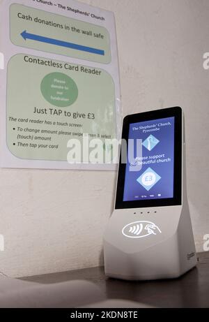 Donation box with card reader inside church Stock Photo - Alamy