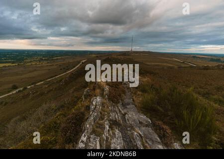 Rocky landscape at Roc'h Trevezel summit at night with clouds slightly ...
