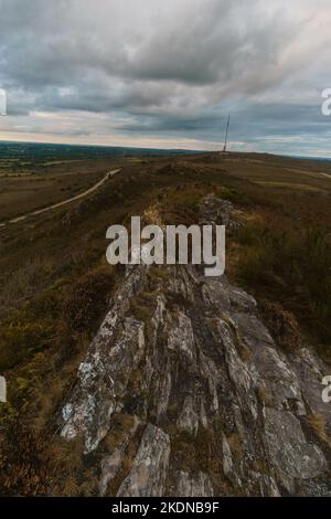 Rocky landscape at Roc'h Trevezel summit at night with clouds slightly ...