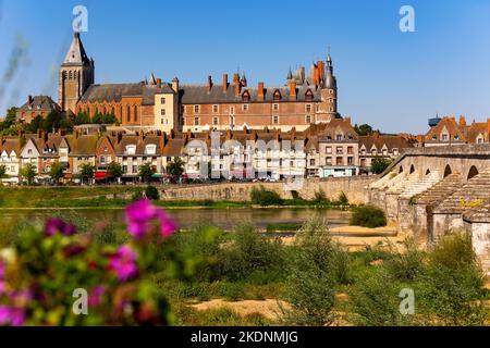 View of Gien with the castle and the old bridge across Loire river ...