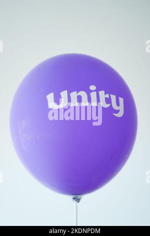 unity text on a purple color ballon Stock Photo - Alamy