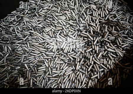 Bullet casings on dark background at armor production plant Stock Photo ...