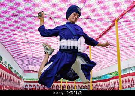 Nihang or Sikh warrior performs Gatka (a form of martial art) using ...