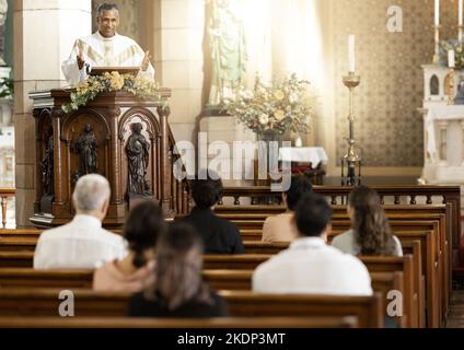 catholic priest reading in the bible Stock Photo - Alamy