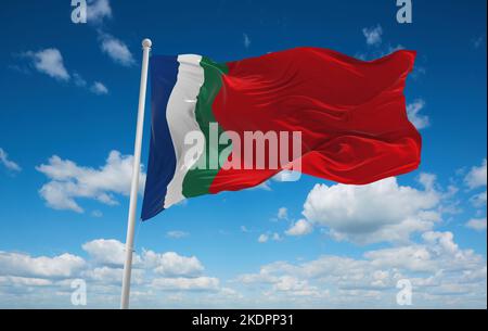 flag of South Moluccas, asia at cloudy sky background, panoramic view ...
