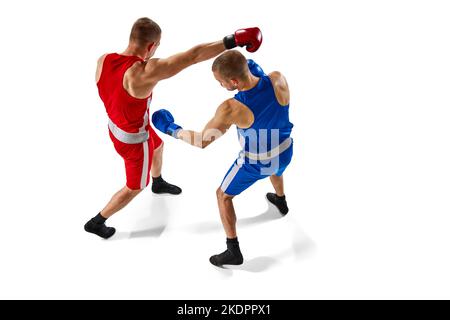 Battle of two boxers. Two muscular professional boxers in blue and red ...