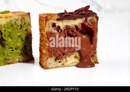 Sliced puff pastry cube shaped croissants with pistachio custard and ...