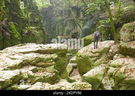 Hikers in the Gaja Gorge, Romai Furdo, the temporarily dried up Roman ...