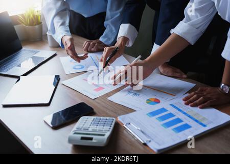 Group business use calculators, documents, computers to analyze work ...