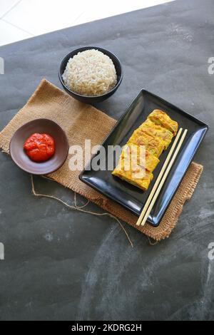 Telur dadar gulung or Tamagoyaki or Japaneses egg roll. Gyeran Mari or ...