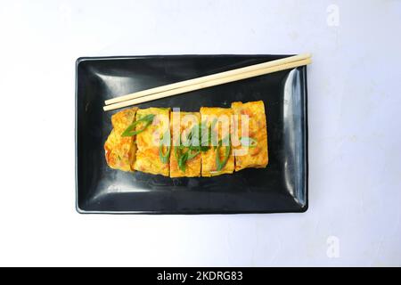 Telur dadar gulung or Tamagoyaki or Japaneses egg roll. Gyeran Mari or ...