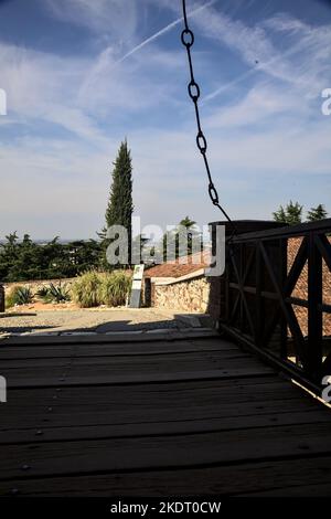 Gate of a castle with its drawbridge lowered Stock Photo - Alamy
