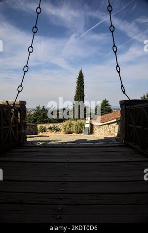 Gate of a castle with its drawbridge lowered Stock Photo - Alamy