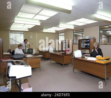 Late 1980s, open-plan office, employees of an electrical supplies ...