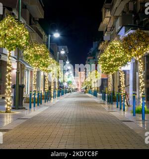 Promenade with trees decorated with Christmas lights Stock Photo - Alamy