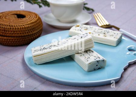 A small amount of delicious white square rice cake Stock Photo - Alamy