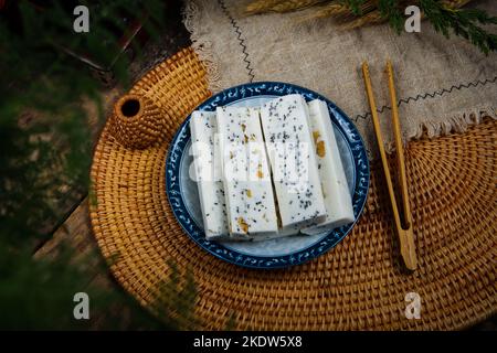A small amount of delicious white square rice cake Stock Photo - Alamy