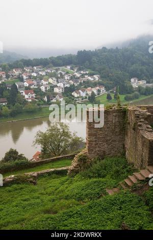 Hirschhorn castle ruins with Neckar river and residential homes and ...