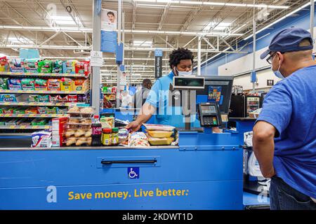 Walmart store interior with male employee stocking a shelf. USA Stock ...