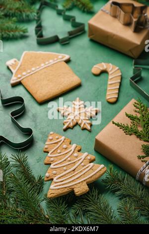Composition with Christmas cookies, ingredients and gifts on black ...
