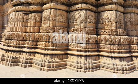 Sculptures of god and goddesses along with male and female figures on ...