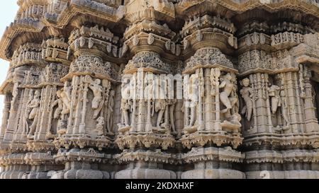 Sculptures of god and goddesses along with male and female figures on ...