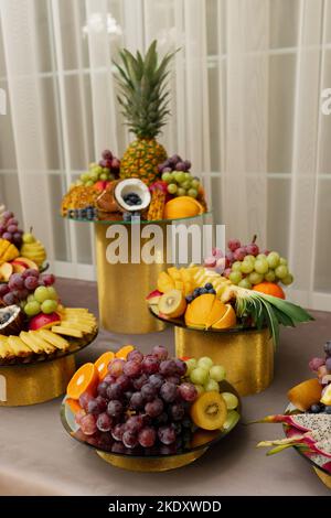 A variety of exotic fruits on a festive table for a banquet Stock Photo ...
