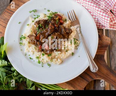 Delicious homemade Beef Curry Dish with rice serve on a plate Stock ...