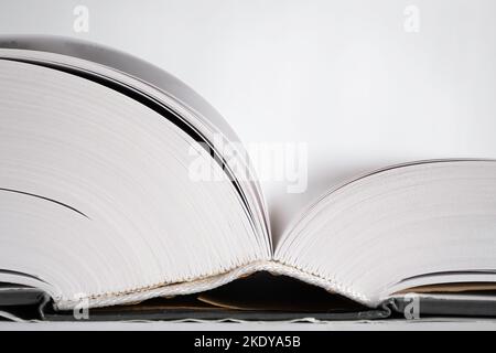 Open book with open pages on both sides. Isolated on black Stock Photo ...