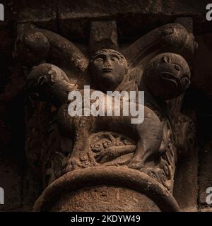 Round human faces above a standing lion with a replaced head ...