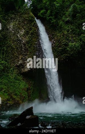 A vertical shot of a Waterfall in Arenal, Costa Rica Stock Photo - Alamy