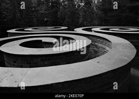 A monochrome shot of the round labyrinth in the landscape Stock Photo ...