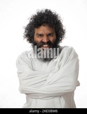 A crazy man expressing anger and discomfort in a straitjacket - the ...