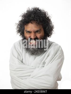 A crazy man expressing anger and discomfort in a straitjacket - the ...